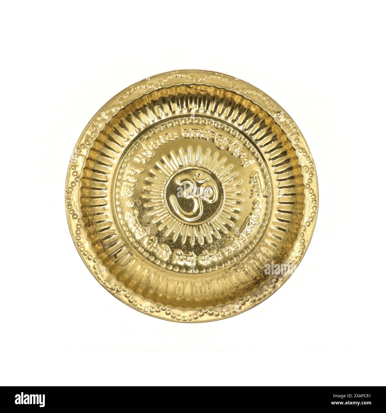 ancient golden tray with an engraving of sacred om symbol on white ...