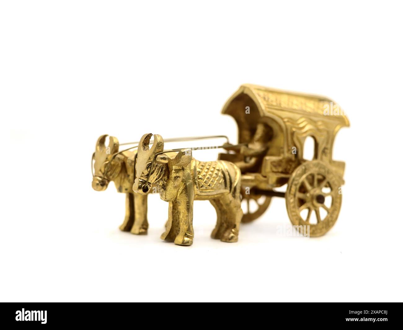 an intricately crafted antique gold model of a vintage bullock cart ...