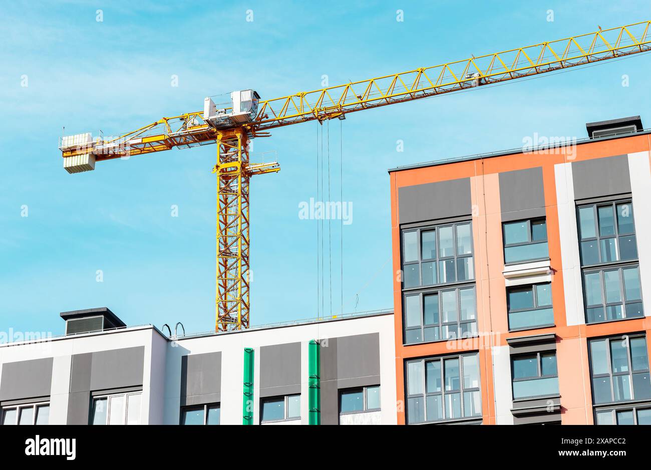 Construction cranes and new housing developments in urban areas ...