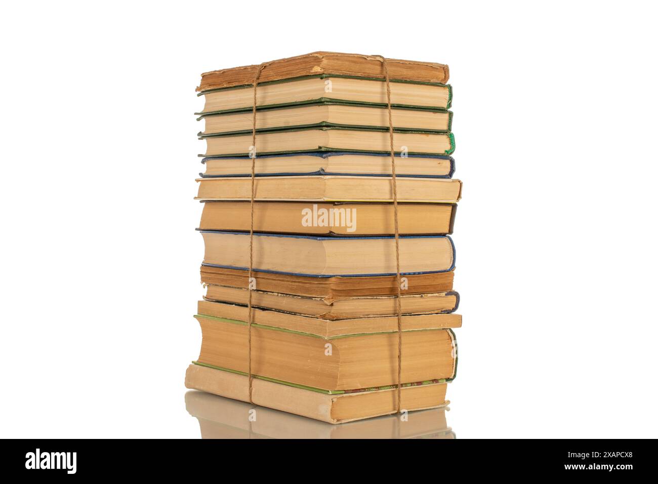 Several books tied with a rope, close-up on a white background Stock ...