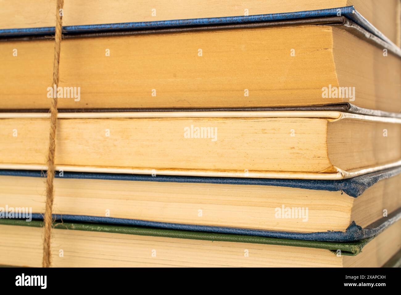 Books tied with rope hi-res stock photography and images - Alamy