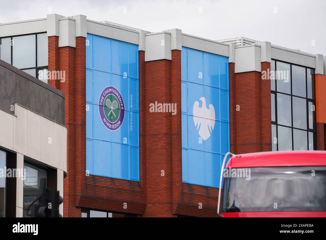 London, UK. 8 June 2024. A building in Wimbledon town centre is covered ...
