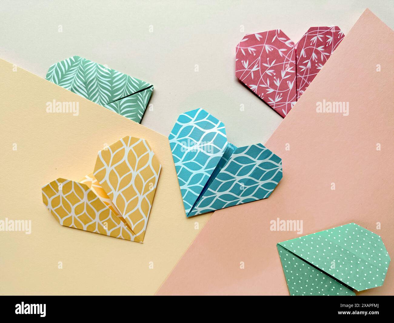 Colorful Origami Paper Hearts on Pastel Geometric Backgrounds for ...