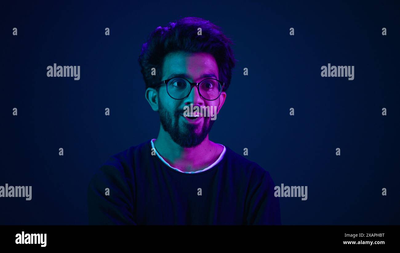 Shocked amazed astonish wonder excited Indian man coder hacker computer ...