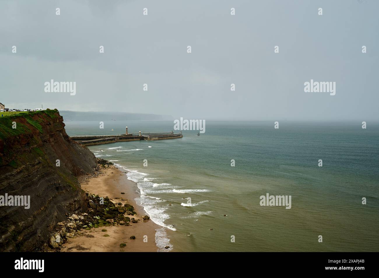 coastal promontory and cloudy sky and sea off british coastline with ...