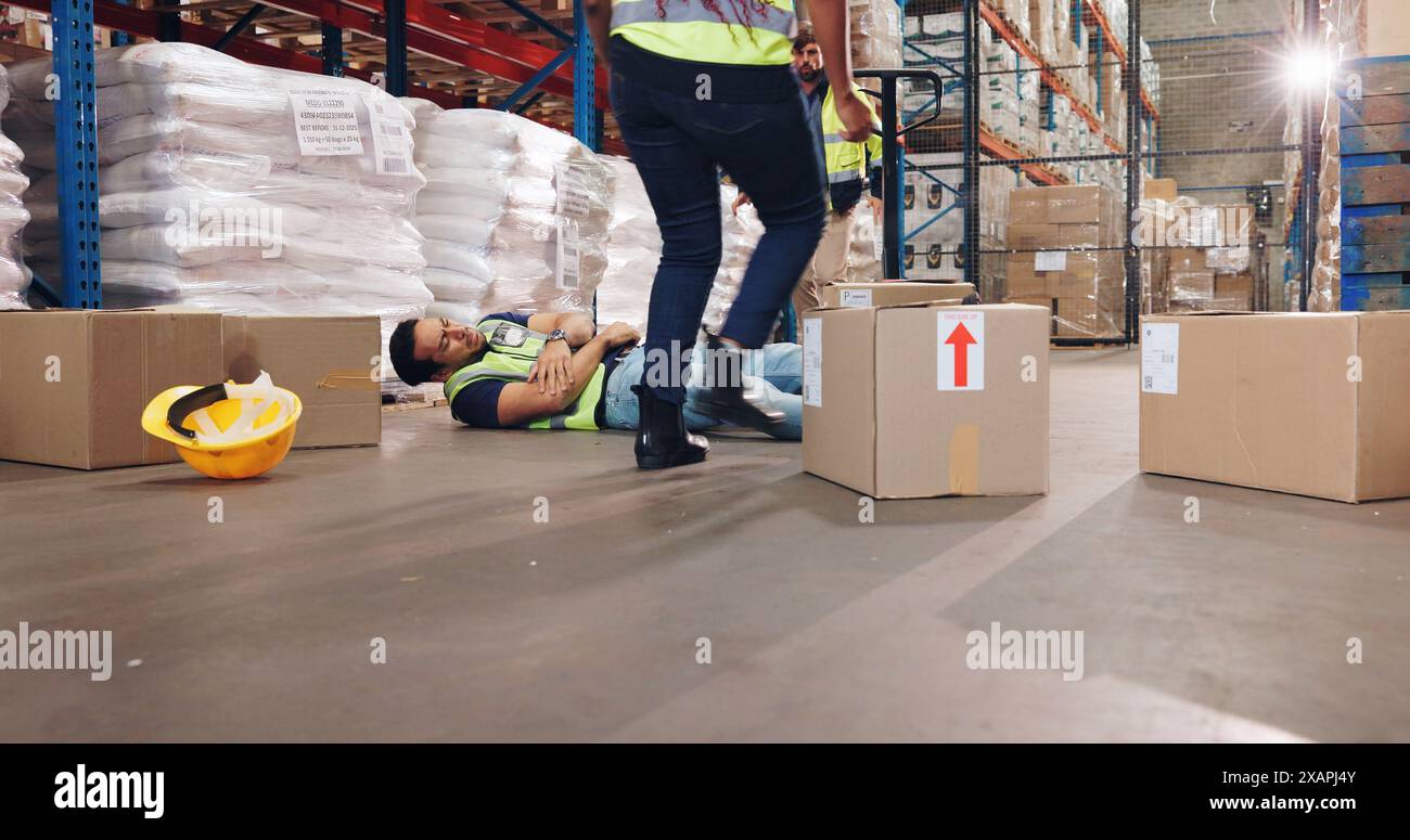 Accident, fall and stock with man in warehouse for delivery ...