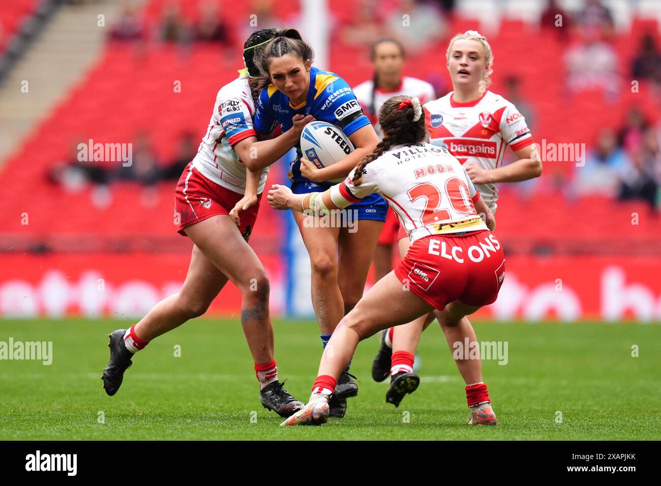 Leeds Rhinos' Ruby Enright (centre) is tackled by St Helens' Beri ...