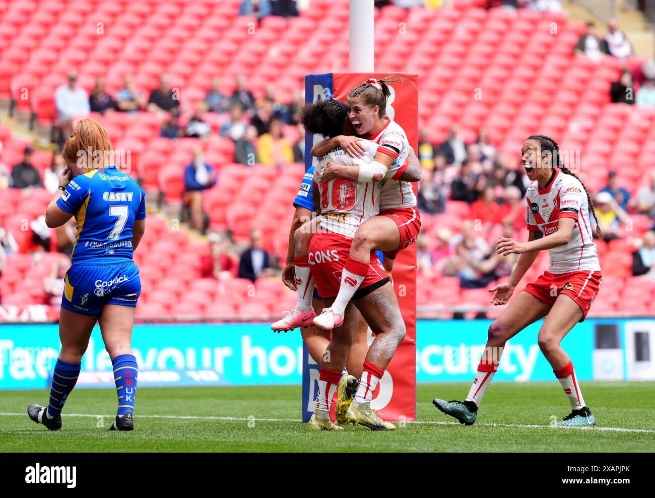 St Helens' Faye Gaskin (left centre) celebrates with Chantelle Crowl ...