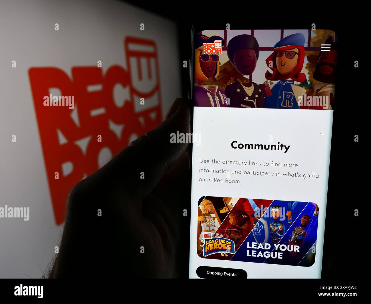 Person holding cellphone with webpage of US video games company Rec ...