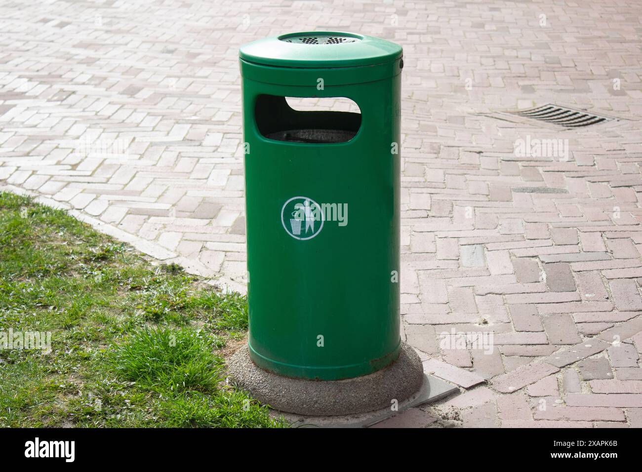 Public trash can on a city street filled with garbage Stock Photo - Alamy