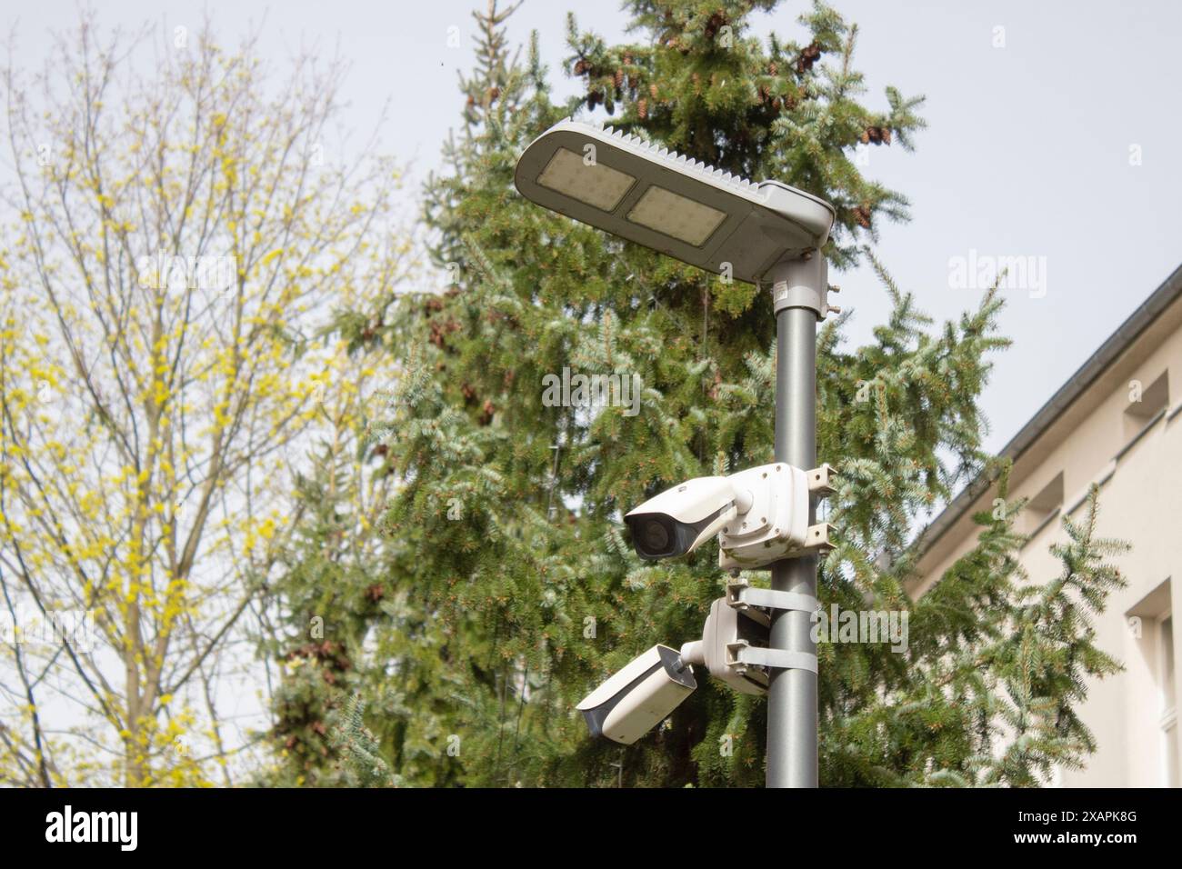 Security cameras mounted on LED lamp post Stock Photo - Alamy