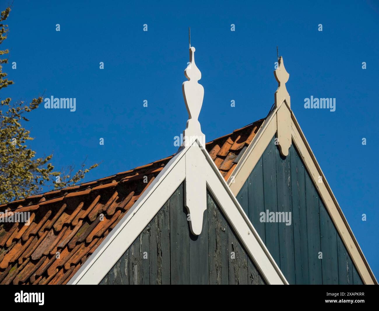 Traditional house roofs with decorative wooden structures under a clear ...