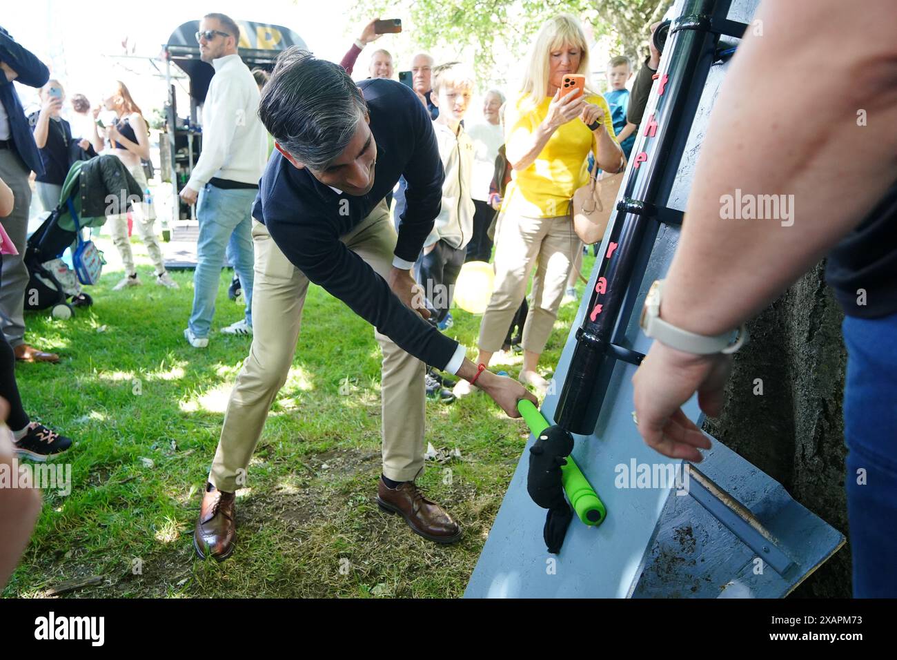 Prime Minister Rishi Sunak playing 'Splat the Rat' at a village fete in ...