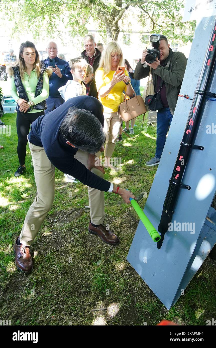 Prime Minister Rishi Sunak playing 'Splat the Rat' at a village fete in ...