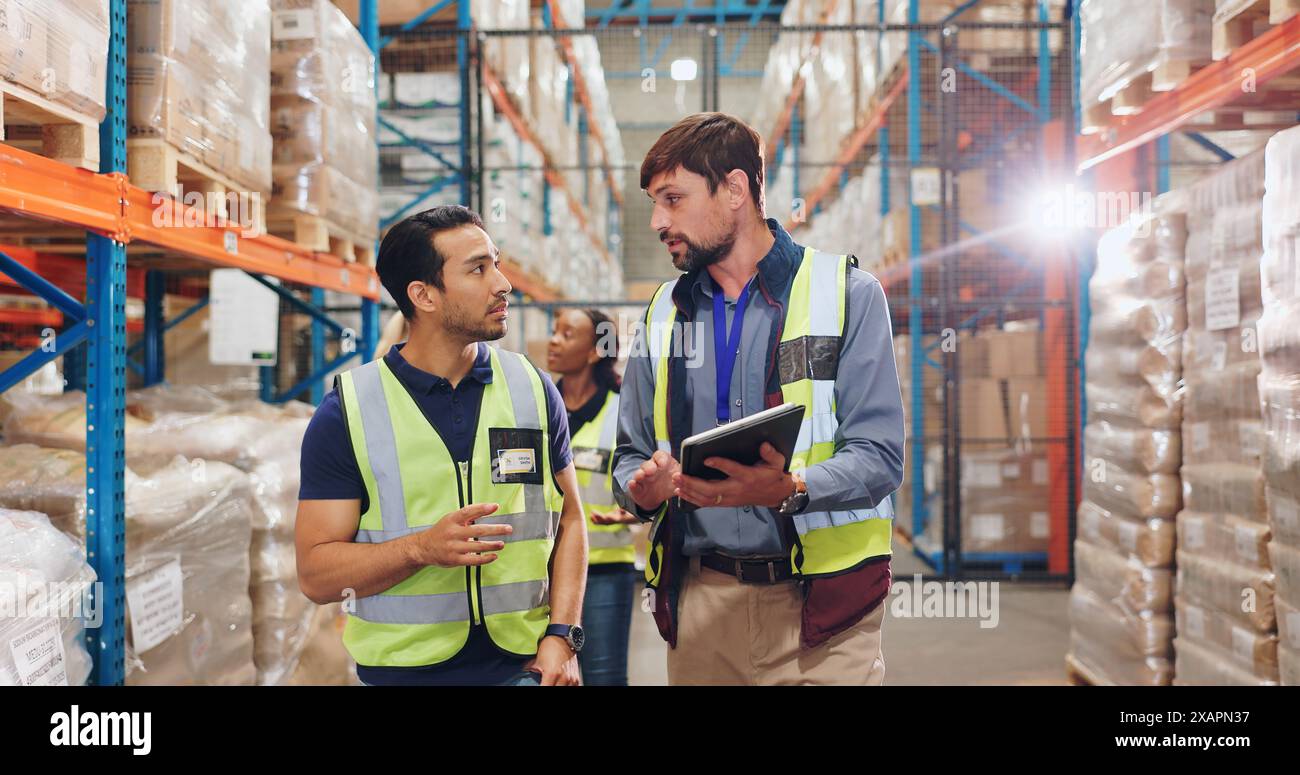 Men, tablet and inspection for stock in warehouse with teamwork ...