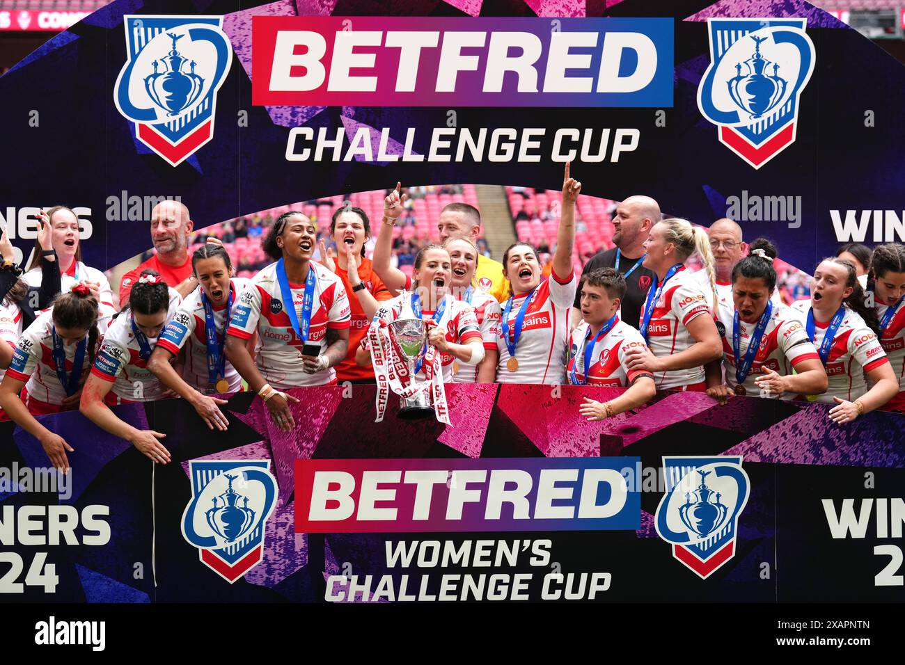 The St Helens players lift the trophy after victory in the Betfred ...