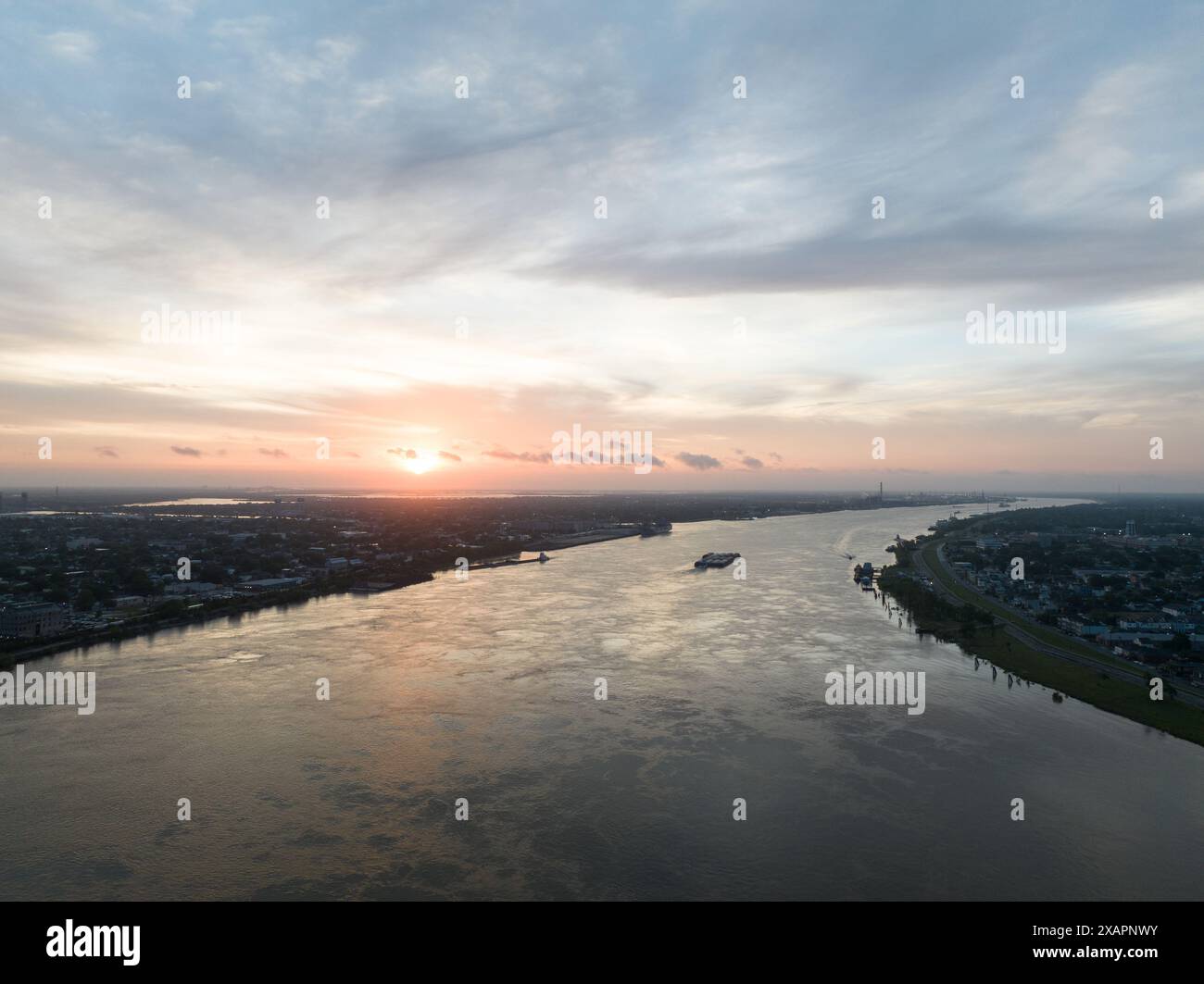 Aerial view of the Mississippi River at dawn near New Orleans, with a ...