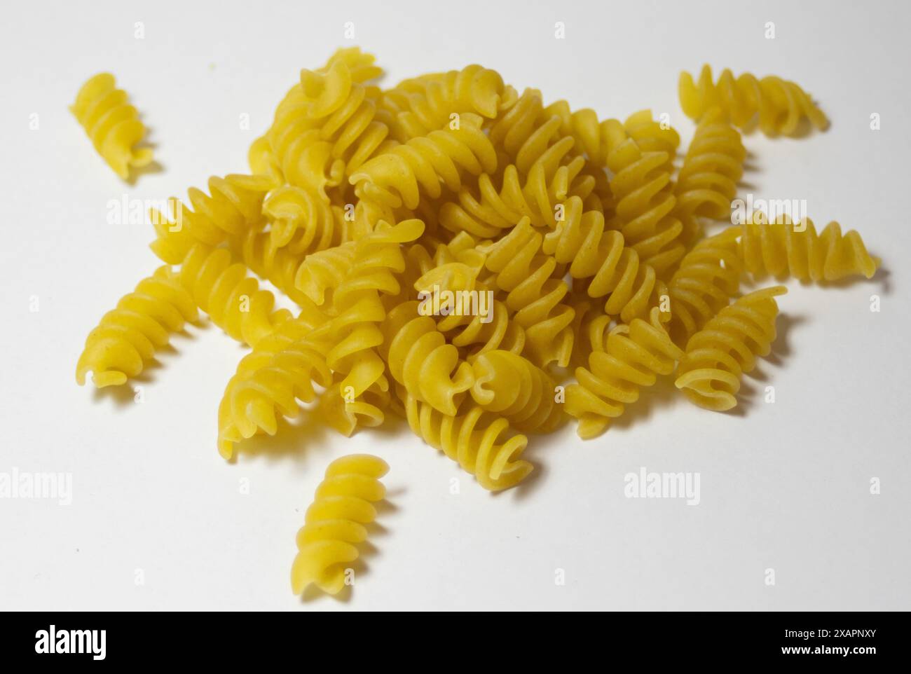 A pile of Rotini corkscrew pasta isolated on white background Stock ...