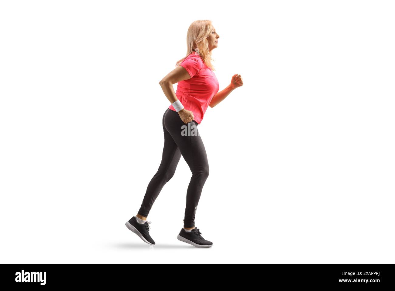 Full length profile shot of a middle aged woman running isolated on ...