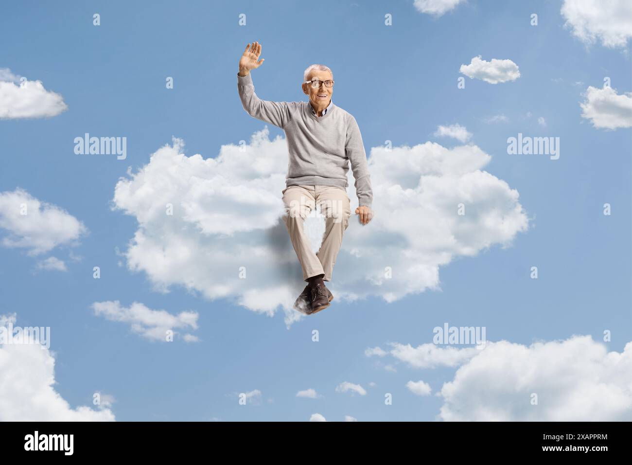 Cheerful elderly man sitting on a cloud and waving from up in the sky ...