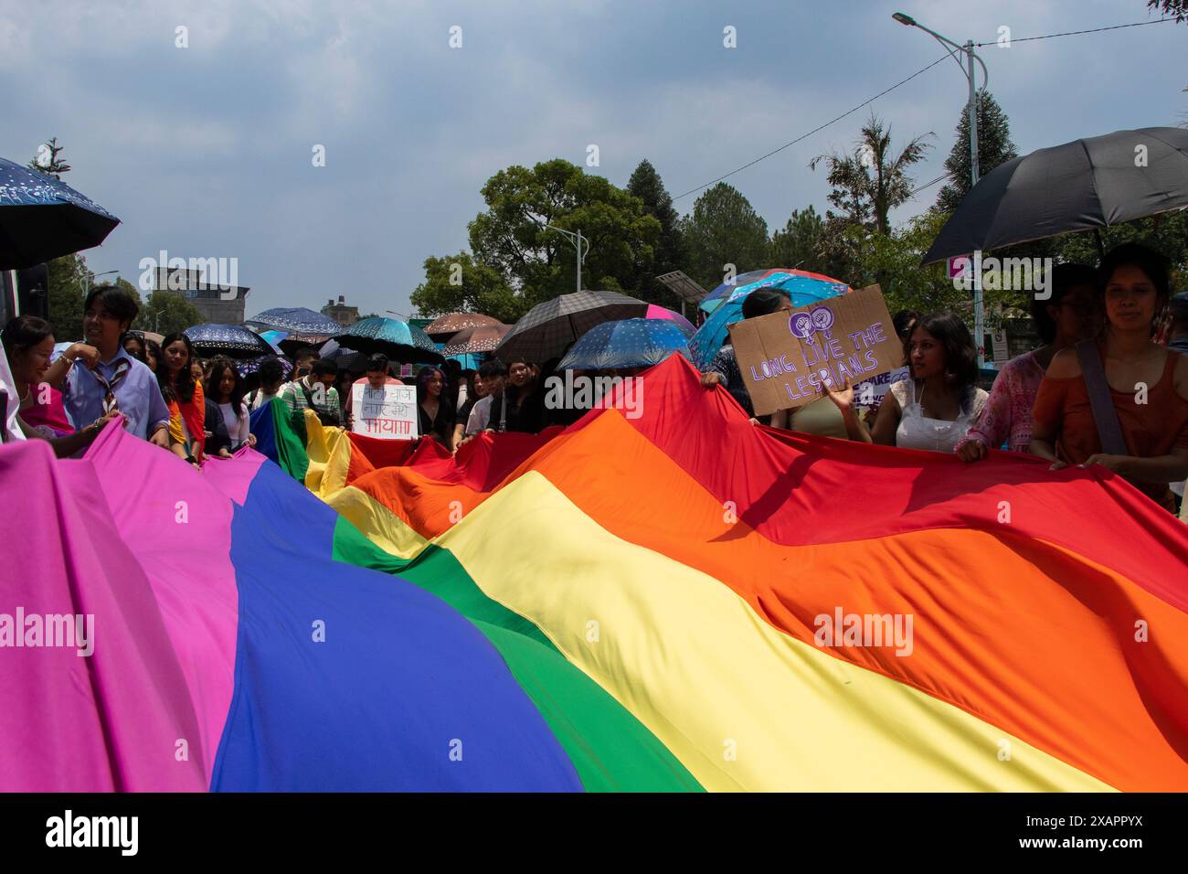 Members of the LGBTQ community wave a pride flag during the 6th annual ...