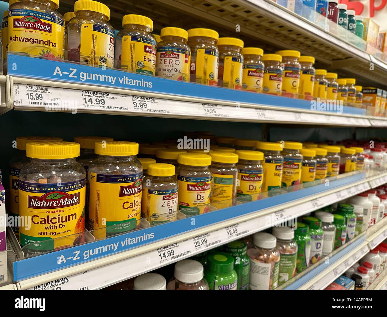 Variety of dietary and vitamin supplement products on the store shelf ...