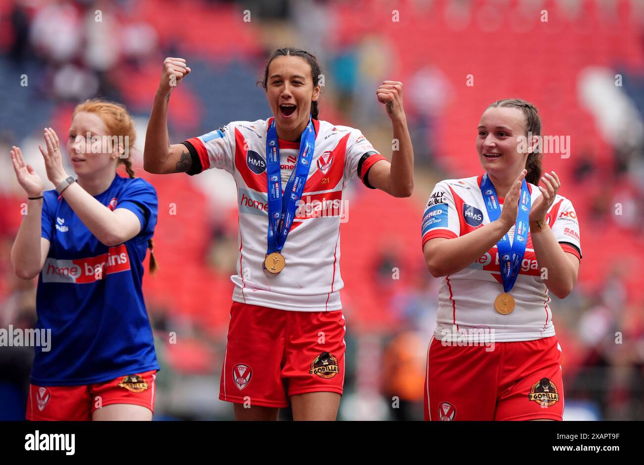 St Helens' Zoe Harris (centre) celebrates after the Betfred Women's ...