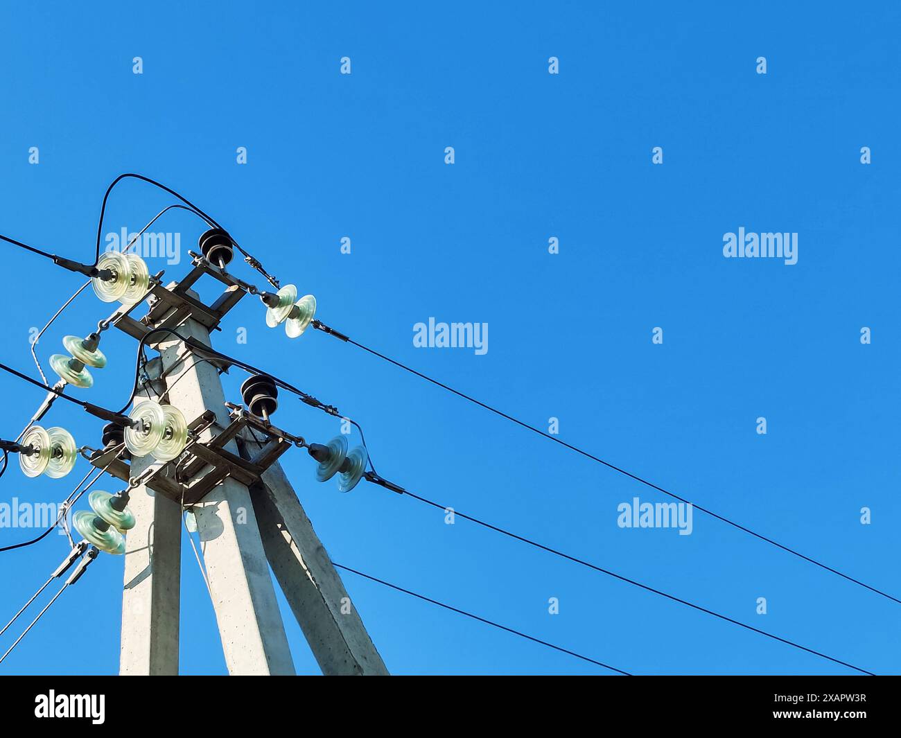 Concrete pillars with electrical wires, coils of cables, connecting ...