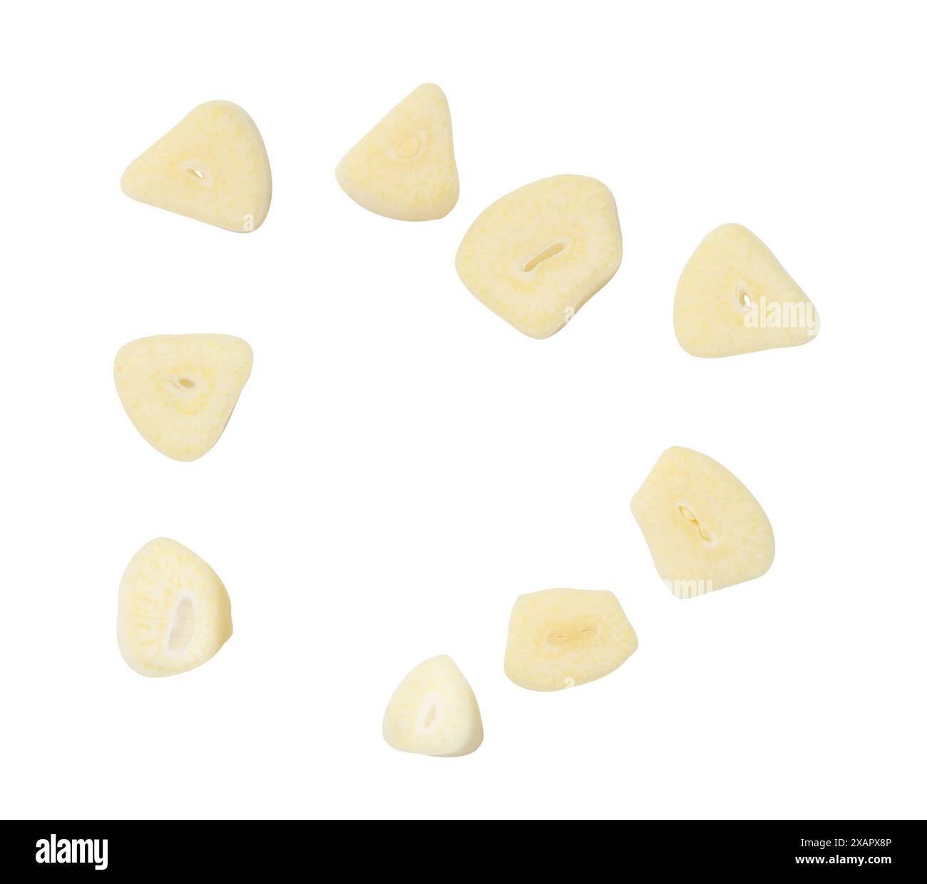 Top view set of white garlic slices or pieces scattering is isolated on ...