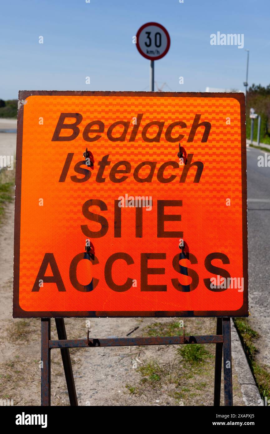 Orange Site Access road sign with a speed limit sign behind it next to ...