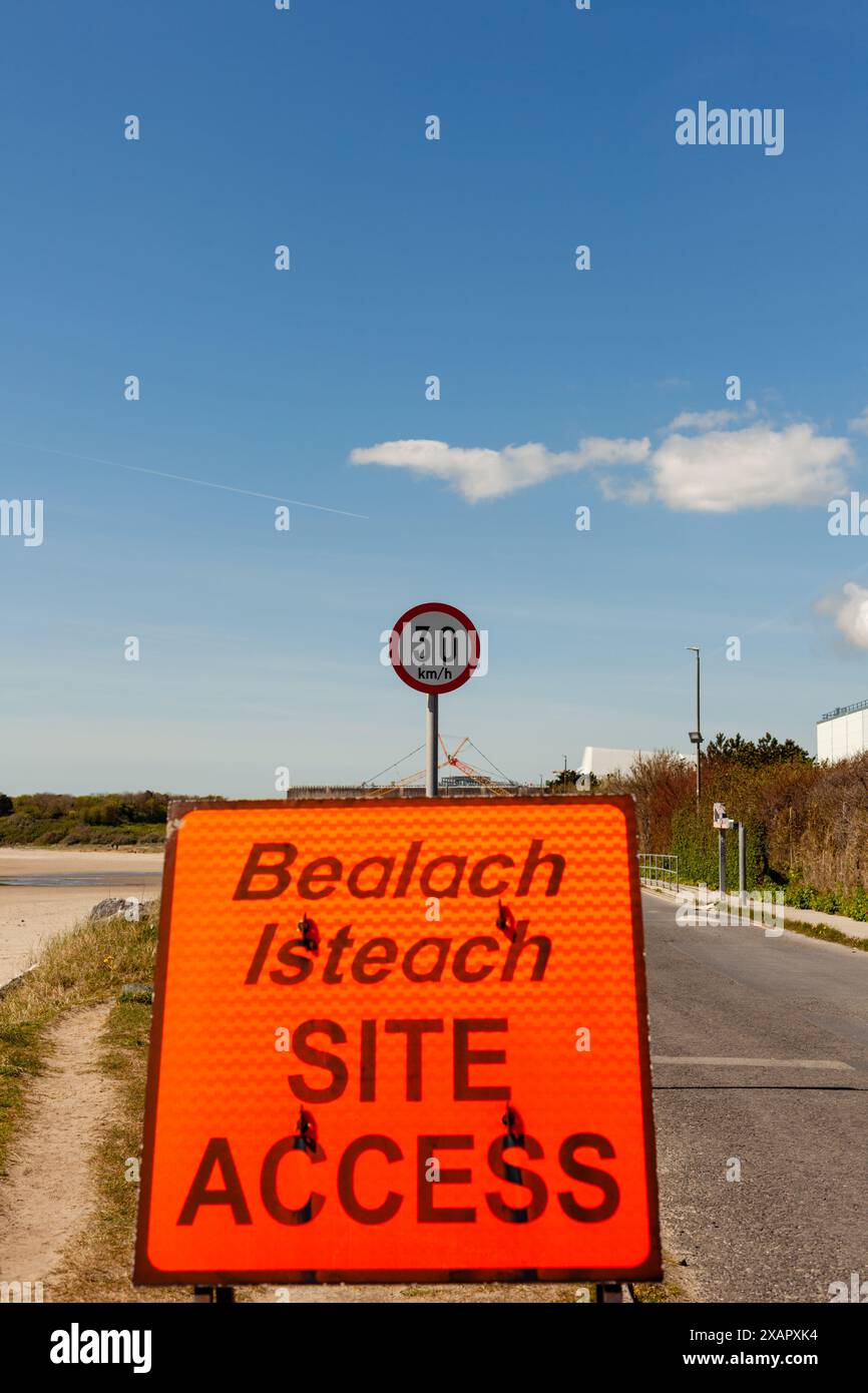 Orange Site Access road sign with a speed limit sign behind it next to ...