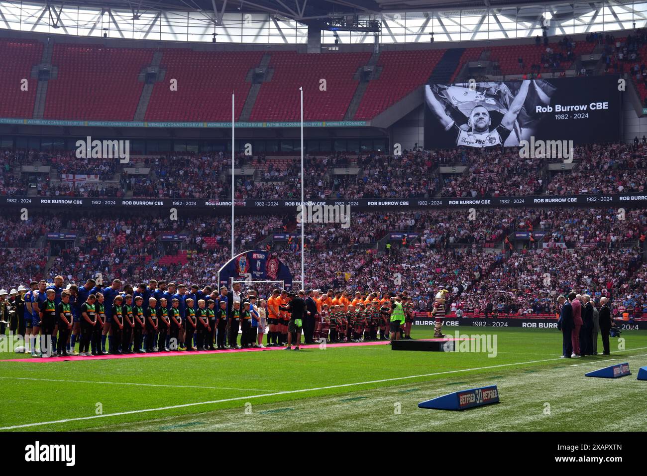 Warrington Wolves and Wigan Warriors players during a minute silence ...