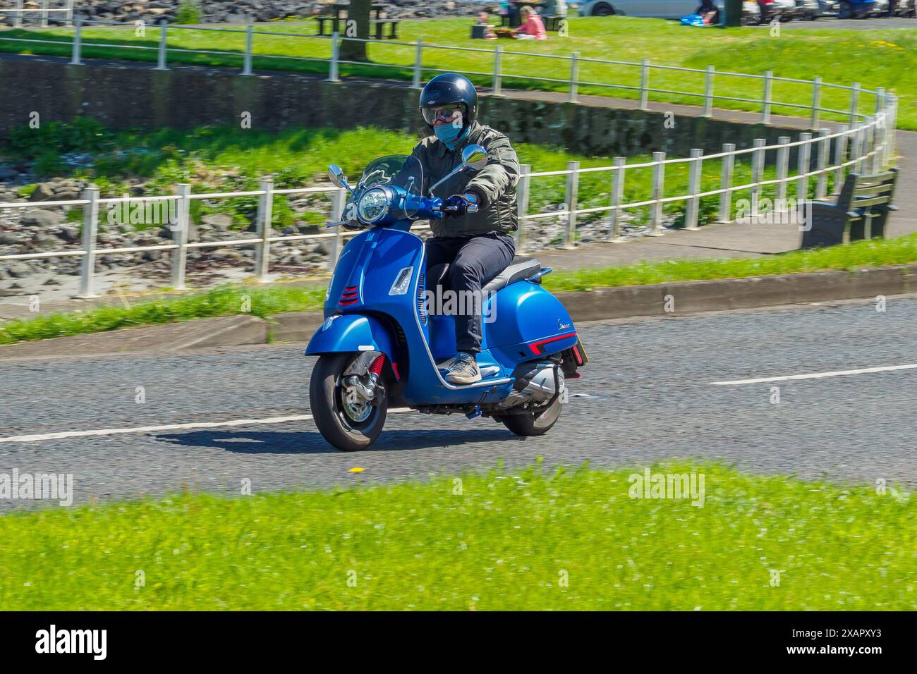 A scooterist enjoying their freedom and adventure lifestyle on their ...