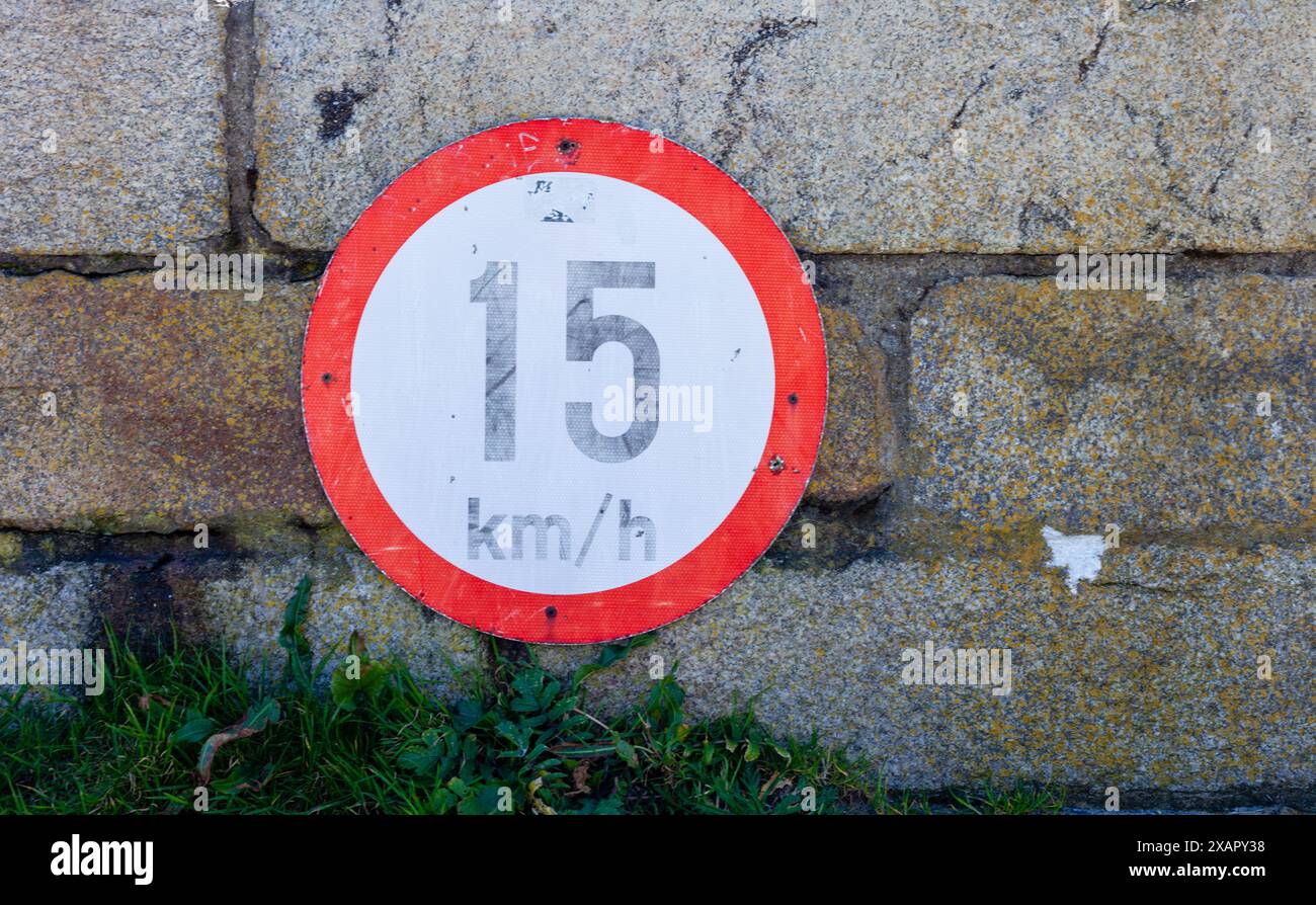 15 Km/hour road sign, traffic sign. The sign is weathered and is on a ...