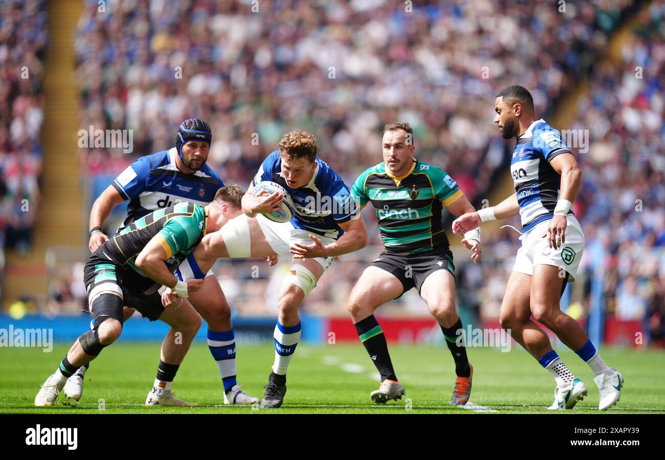 Bath Rugby's Ted Hill is tackled by Northampton Saints' Tommy Freeman ...