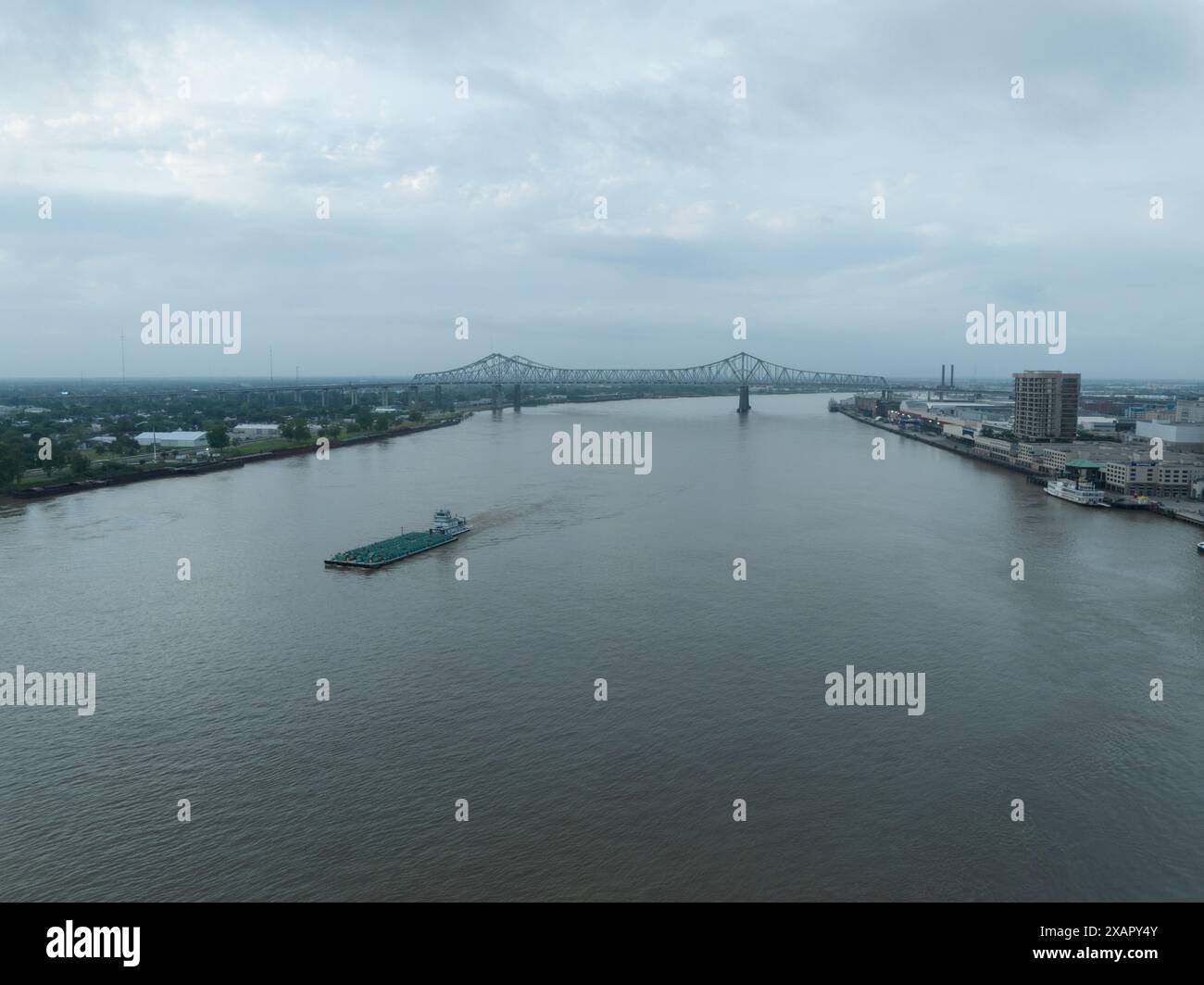 Aerial view of a barge passing by the downtown New Orleans skyline on ...