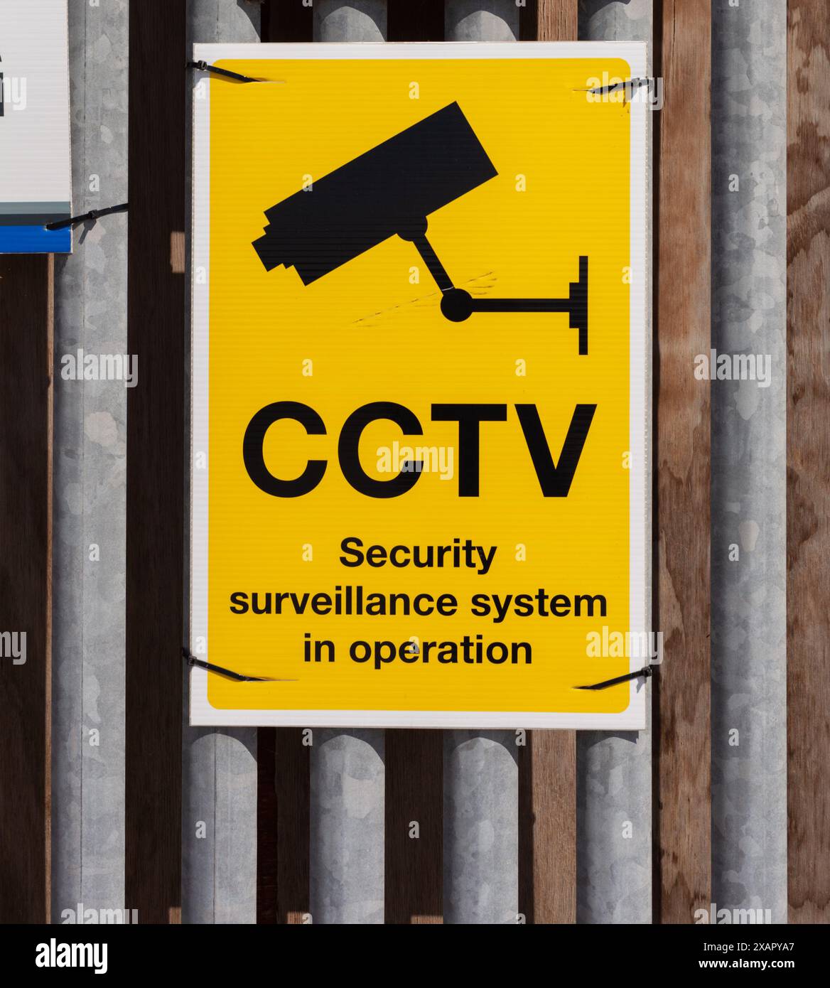 CCTV, security surveillance system in operation sign zip-tied to a ...