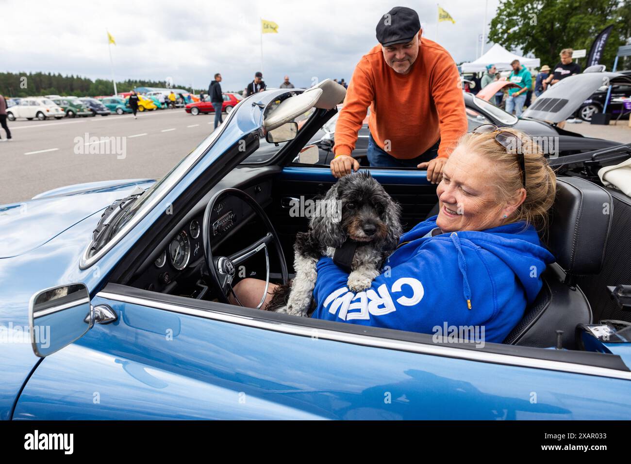 Mikael Karlsson and Anna Engberg, with ther dog Ella, in a Volkswagen ...