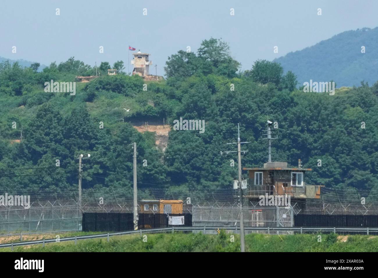 FILE - A North Korean military guard post, top, and South Korean post ...