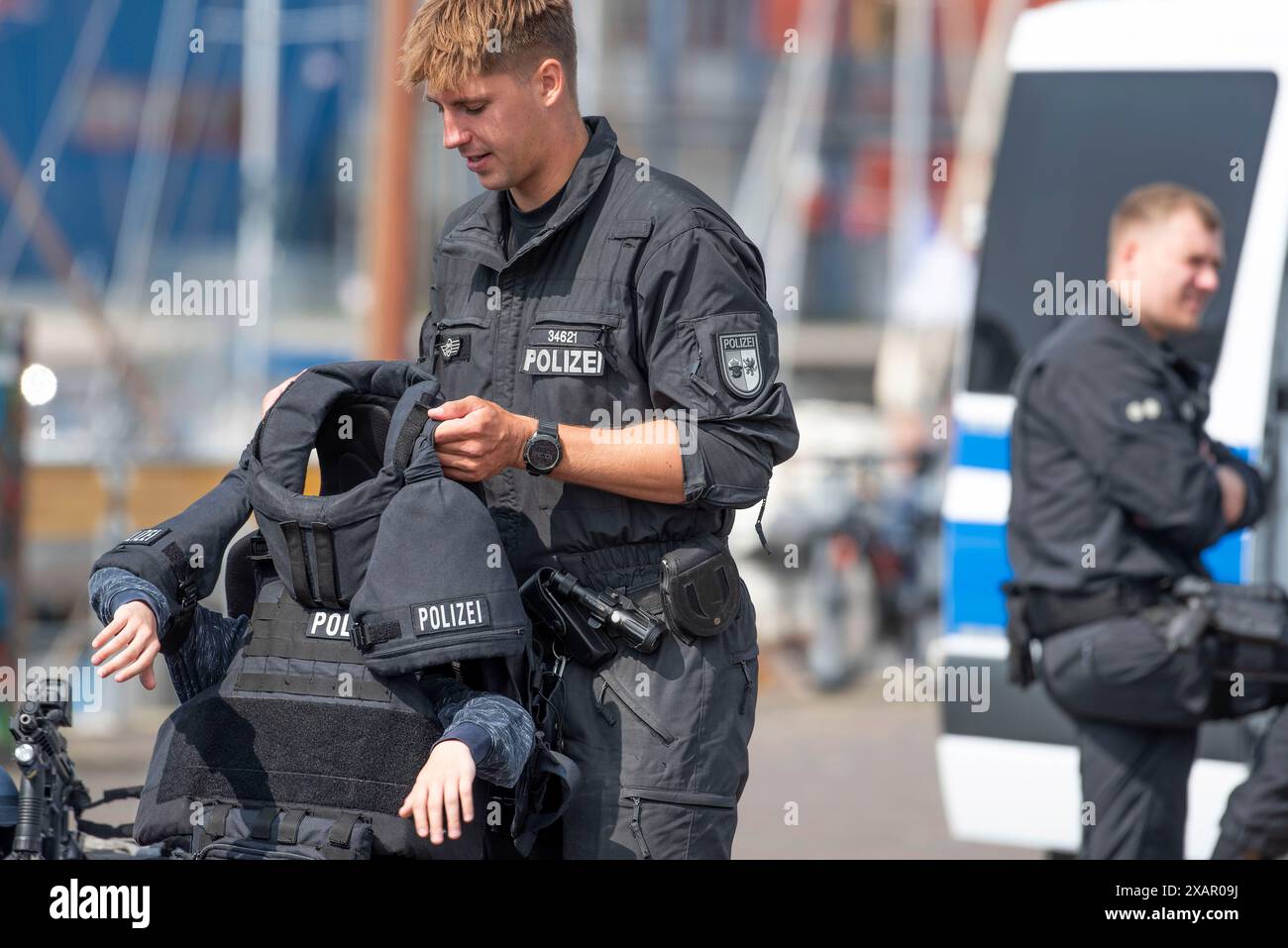 08 June 2024, Mecklenburg-Western Pomerania, Rostock: A police officer ...