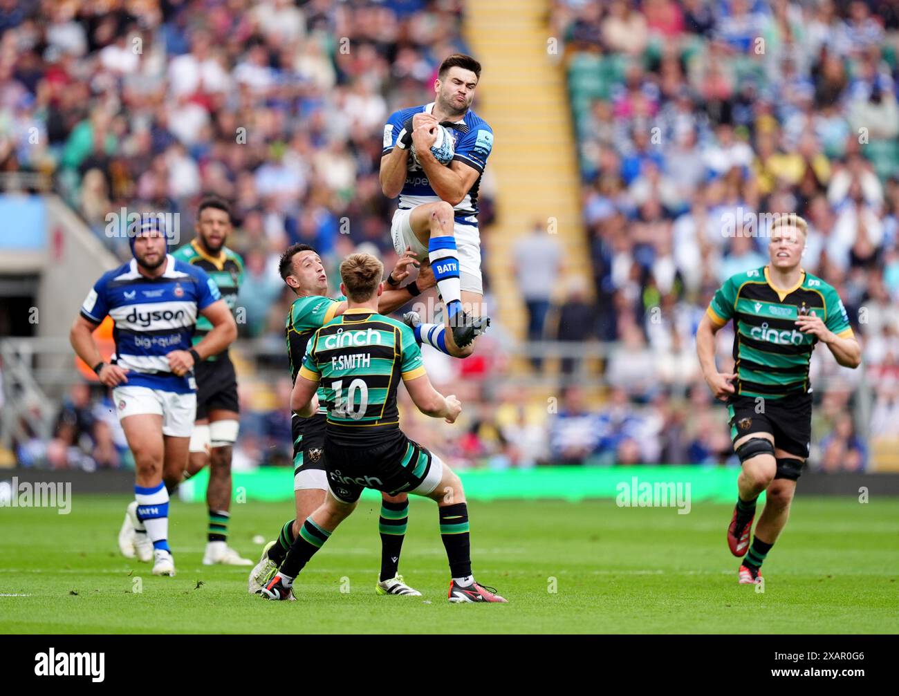 Bath Rugby's Will Muir (top) catches the ball above Northampton Saints ...