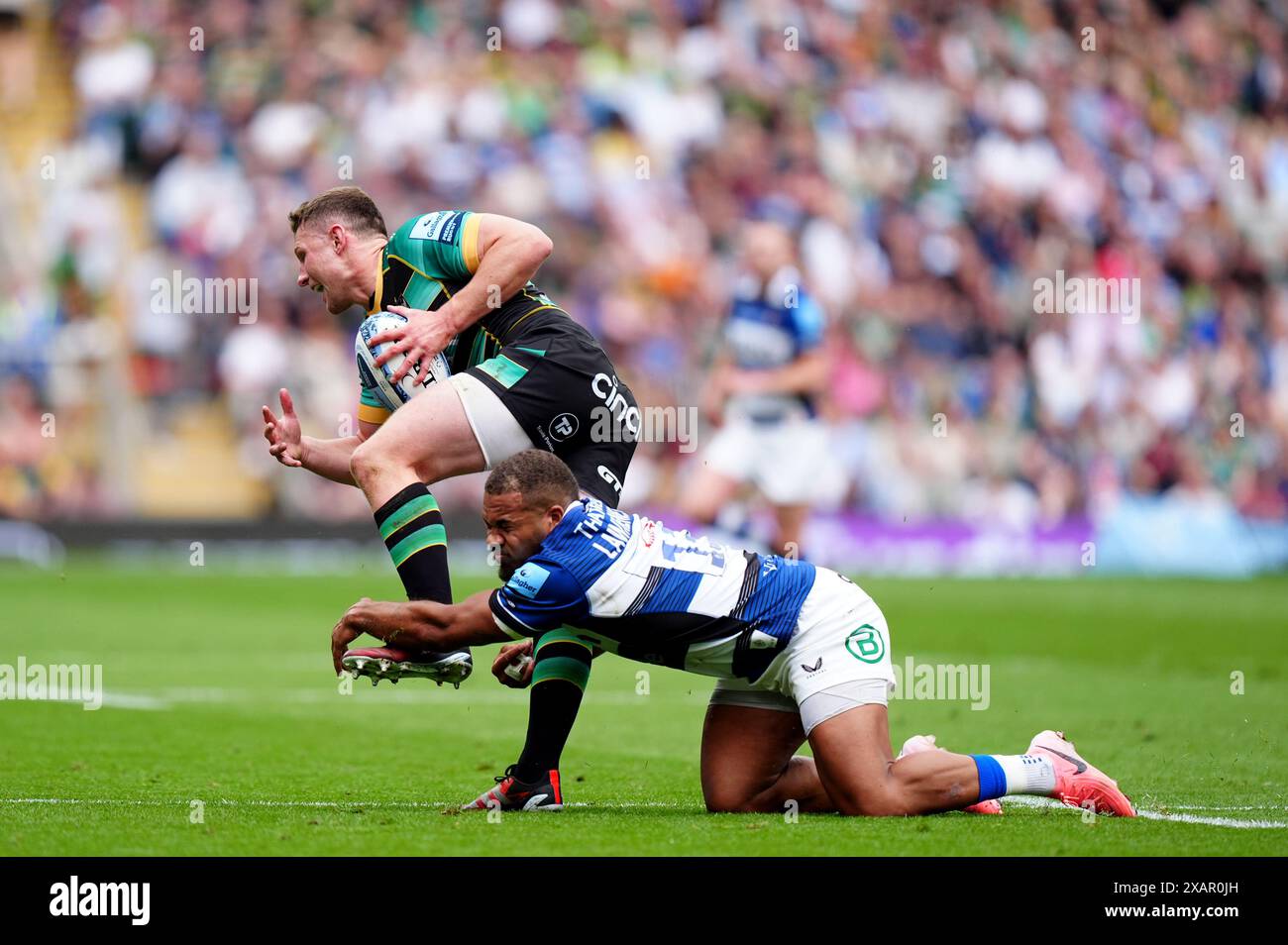 Northampton Saints' Fraser Dingwall (left) is tackled by Bath Rugby's ...