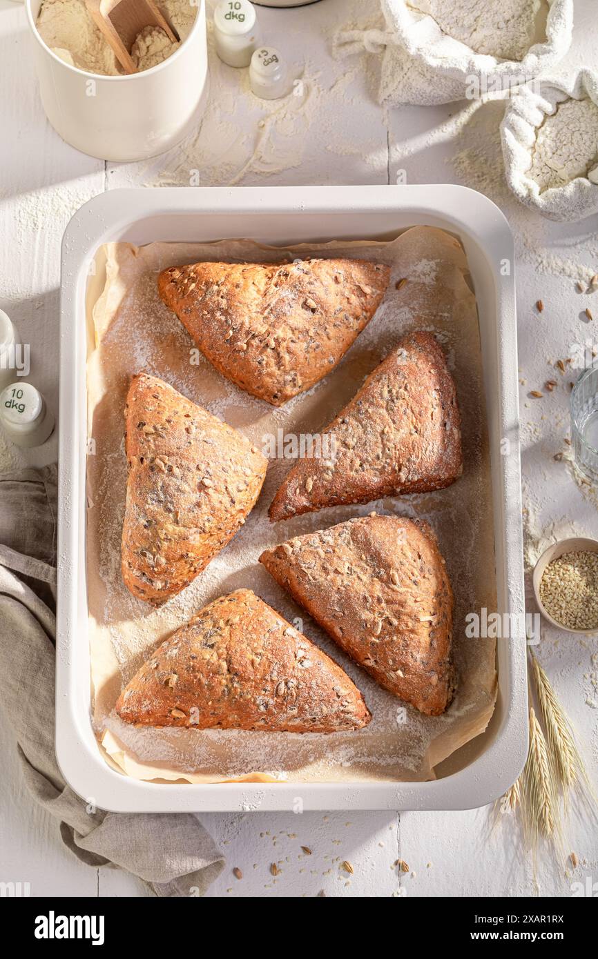 Homemade and tasty triangular buns in rustic bakehouse. Triangular buns ...