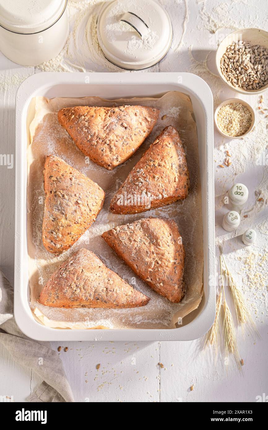 Homemade and tasty triangular buns baked in a bakehouse. Triangular ...
