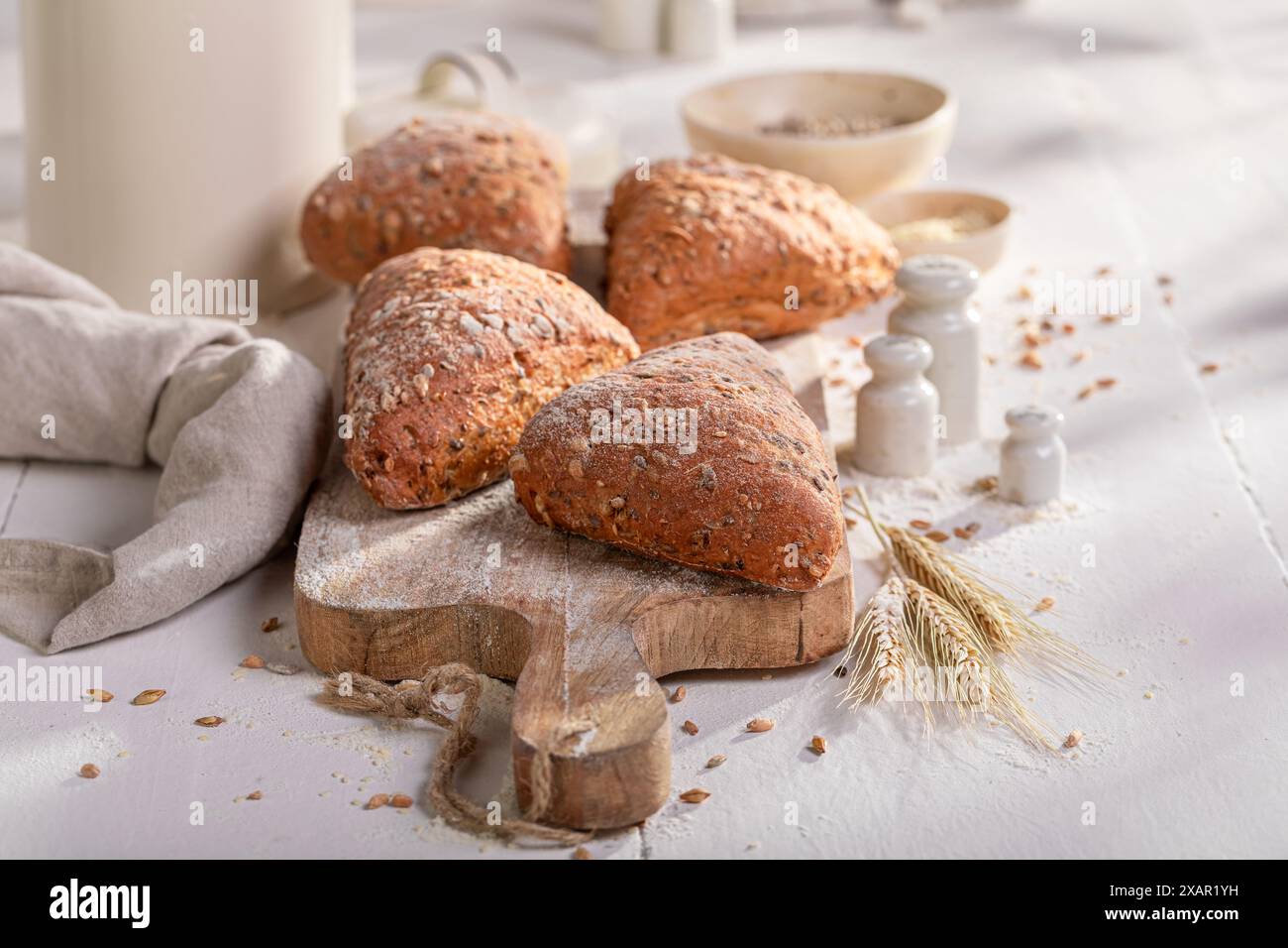 Brown and tasty triangular buns baked in a bakehouse. Triangular rolls ...