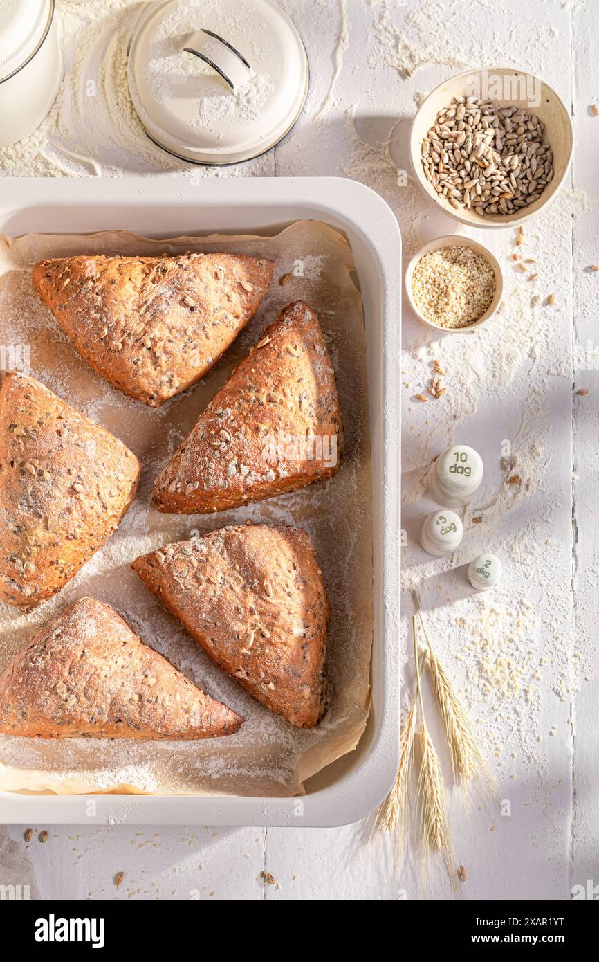 Hot and healthy triangular buns in rustic bakehouse. Triangular rolls ...