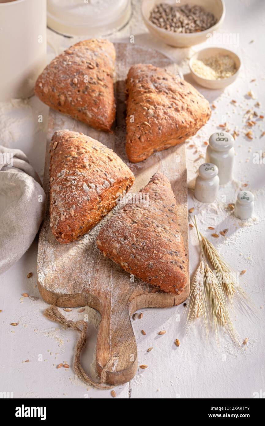 Brown and tasty triangular rolls baked in the bakery. Triangular rolls ...