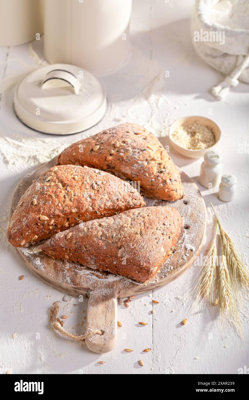 Brown and tasty triangular buns freshly baked in home bakery ...