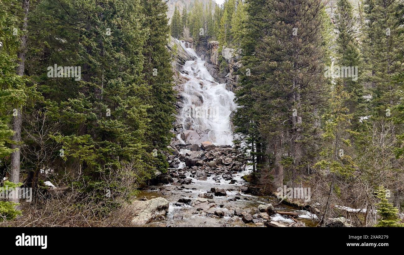 Hidden waterfalls during hike at Jenny lake trail in Mt. Teton National park in Wyoming, USA ...