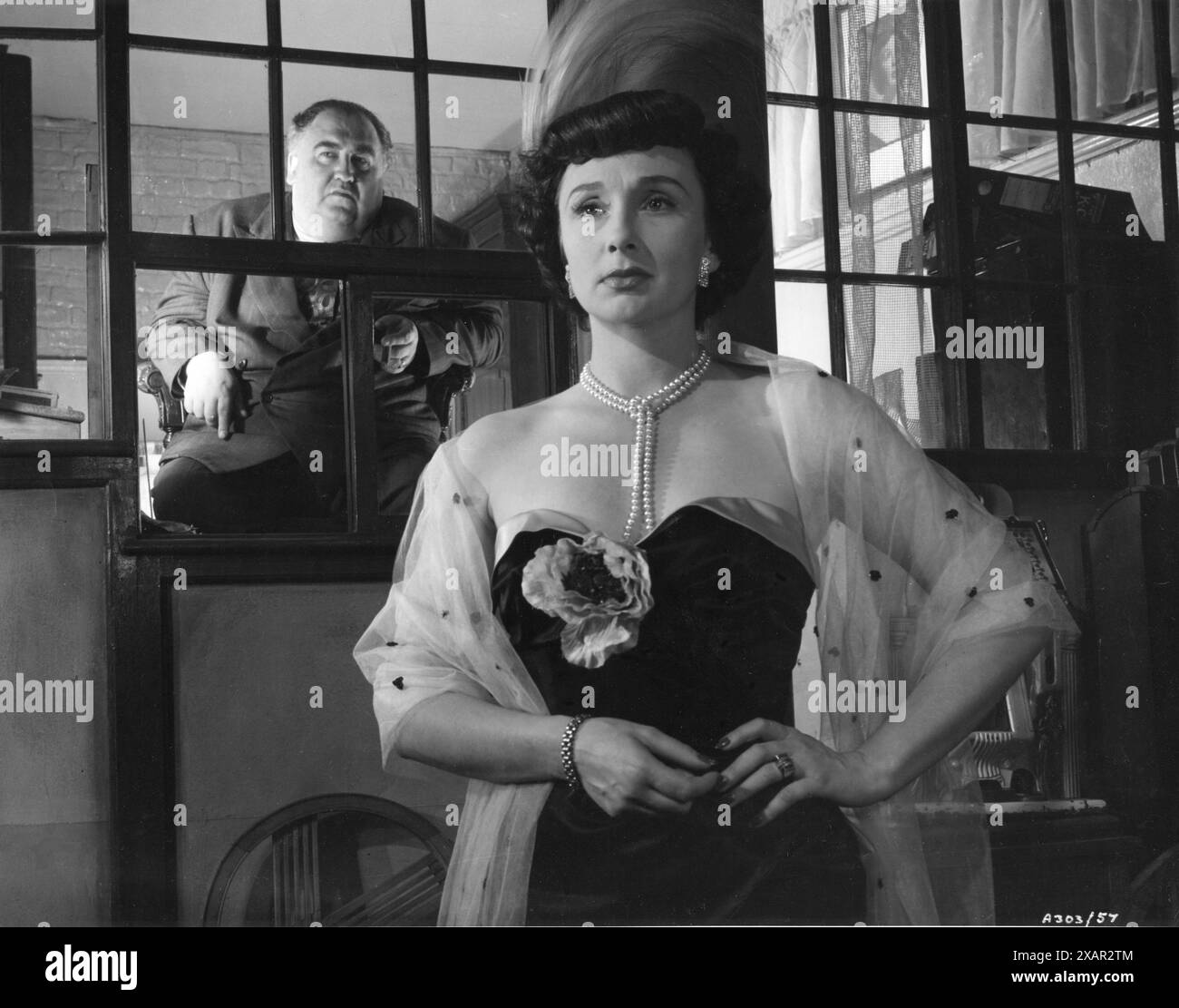 FRANCIS L. SULLIVAN and GOOGIE WITHERS in a scene from NIGHT AND THE ...